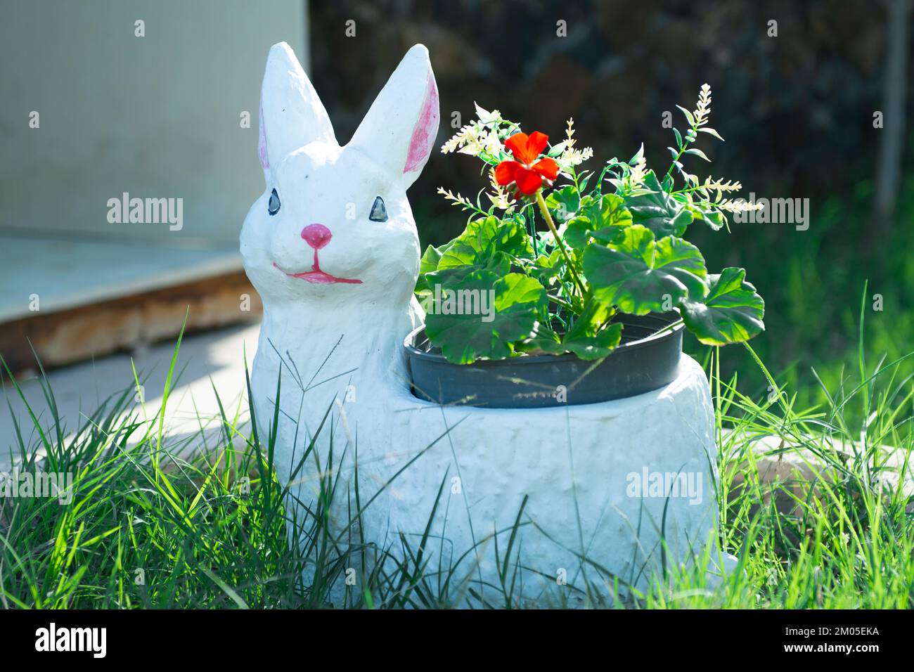 Blue rabbit with flowers hi-res stock photography and images - Alamy