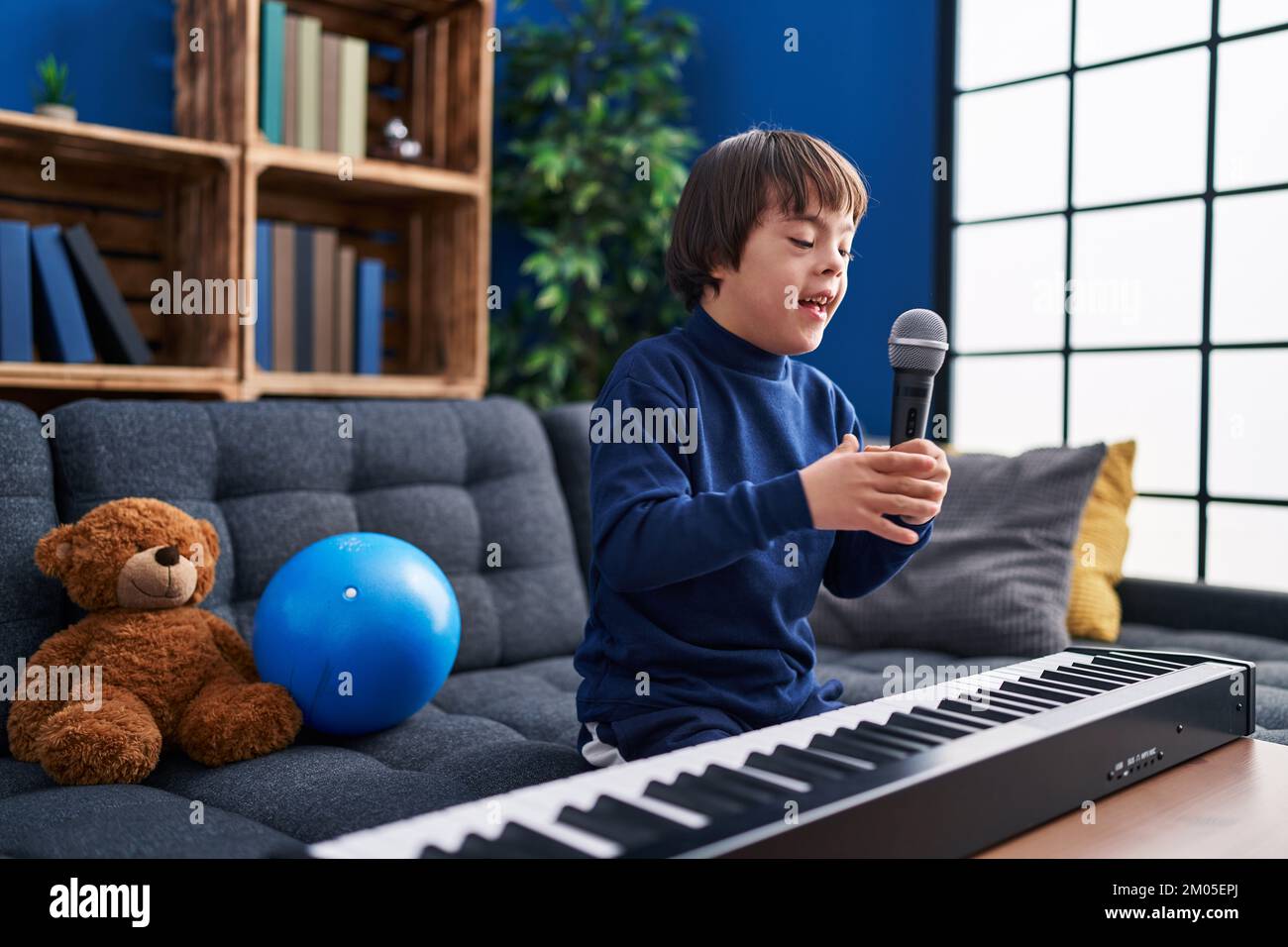 Child down syndrome instrument hi-res stock photography and images - Alamy