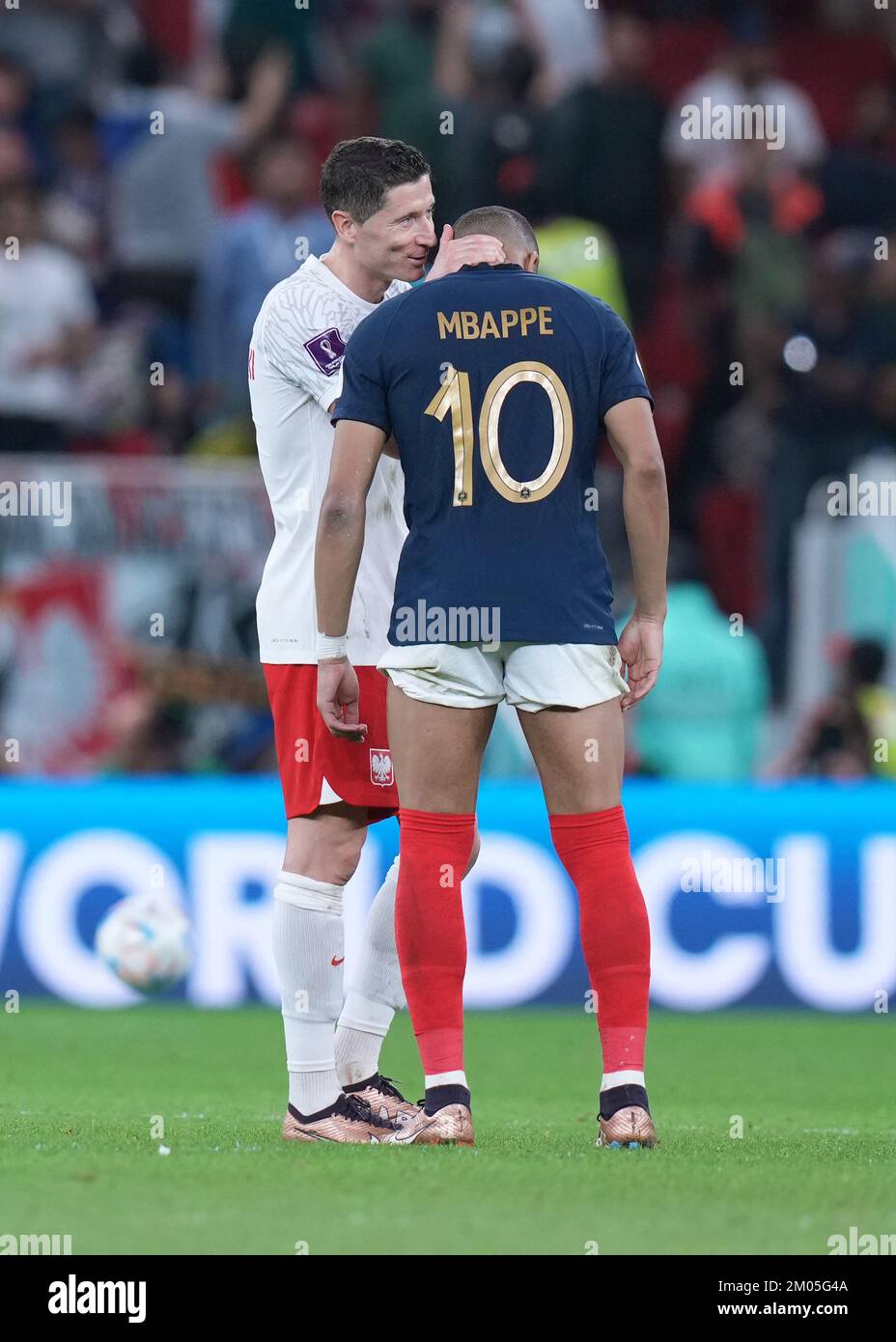 Poland’s Robert Lewandowski interacts with France’s Kylian Mbappe ...