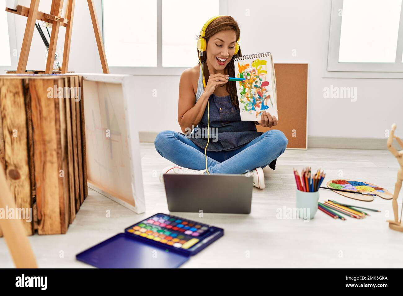 Young hispanic artist woman smiling happy drawing at art studio Stock ...