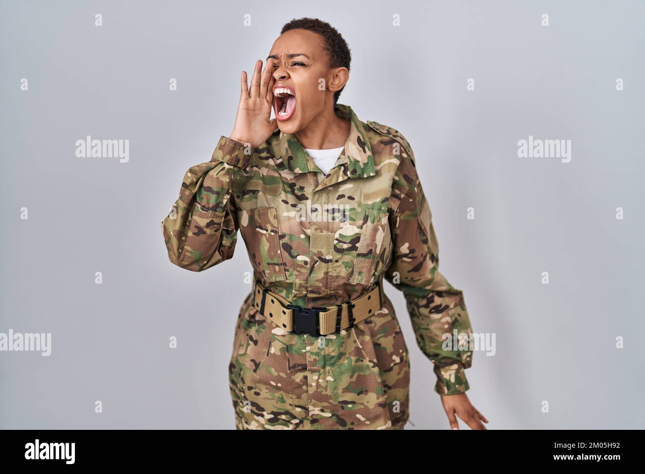 Beautiful african american woman wearing camouflage army uniform ...