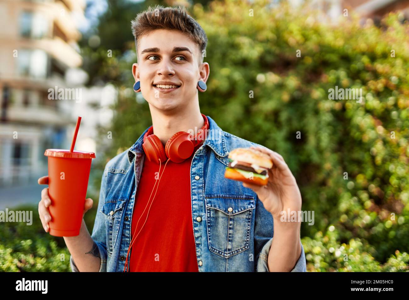 Blonde man eating burger hi-res stock photography and images - Alamy