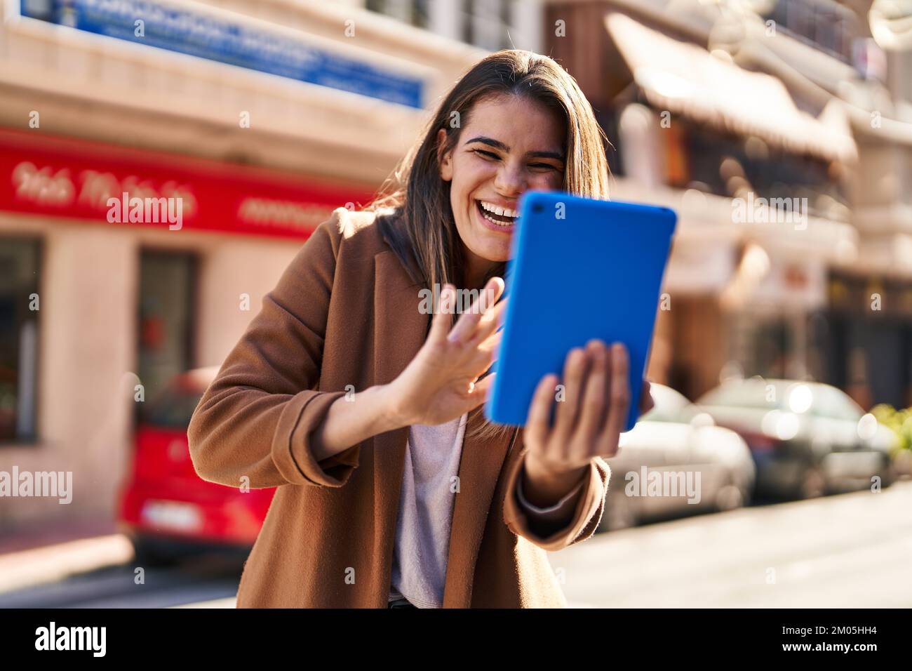 Young beautiful hispanic woman smiling confident having video call at ...