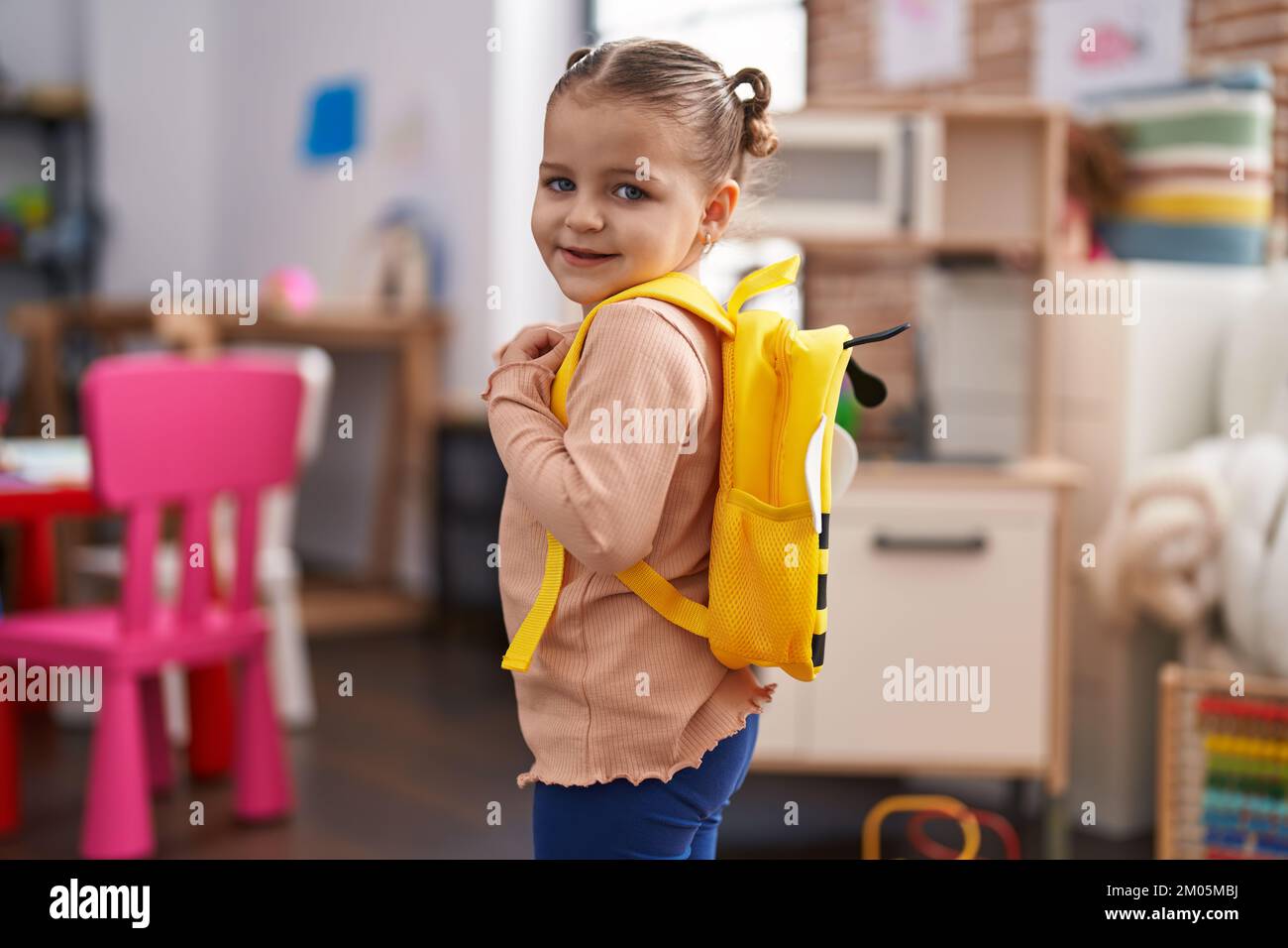 Adorable hispanic girl student smiling confident wearing backpack at ...