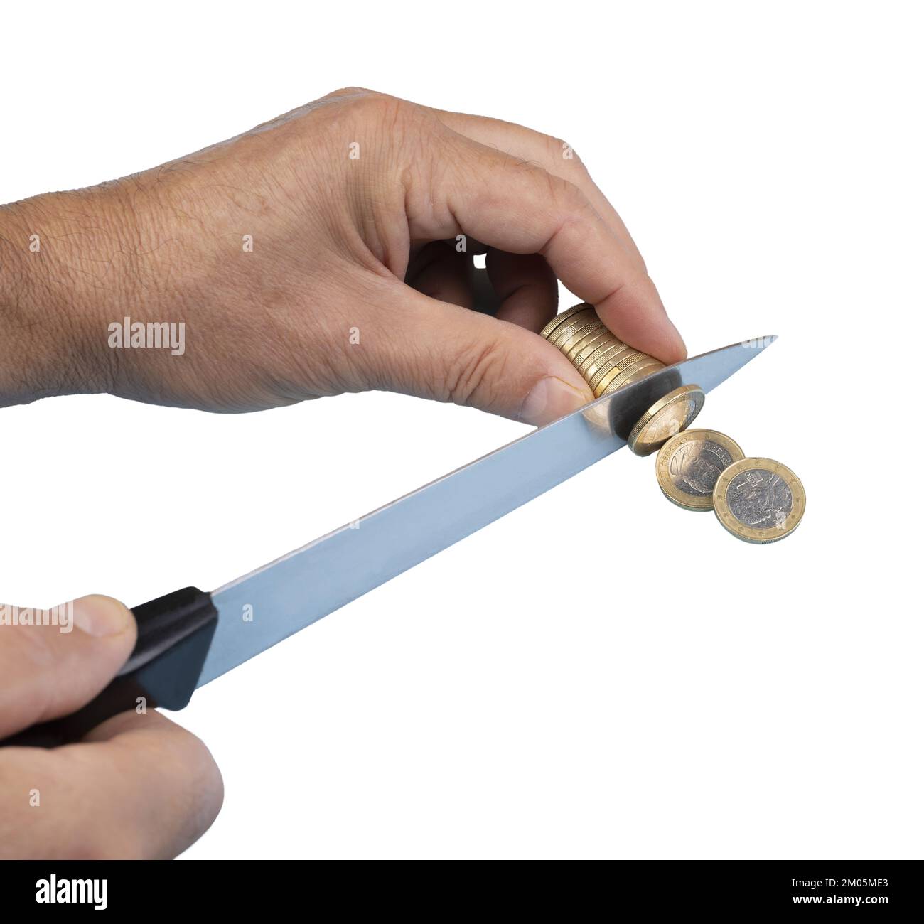 the gesture of cutting one euro coins with the knife. concept of ...