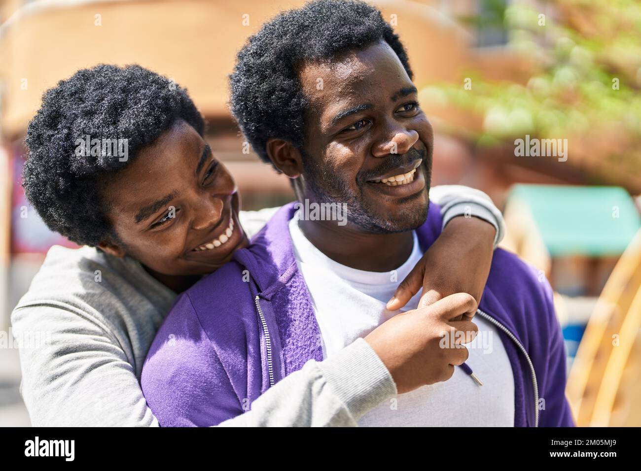 African american man and woman couple smiling confident hugging each ...