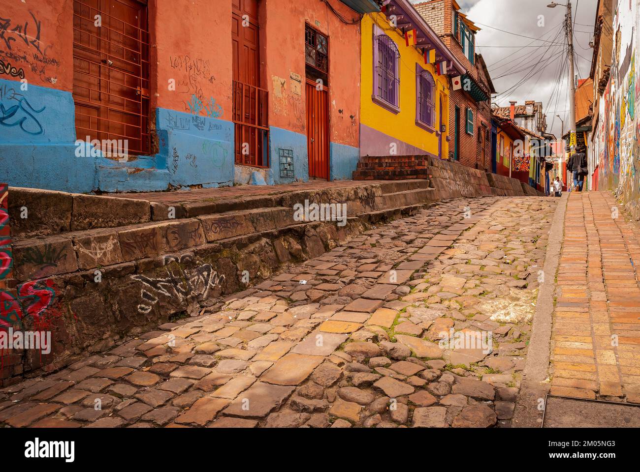 Colorful houses in a old cobbled street, La Candelaria, Bogota ...