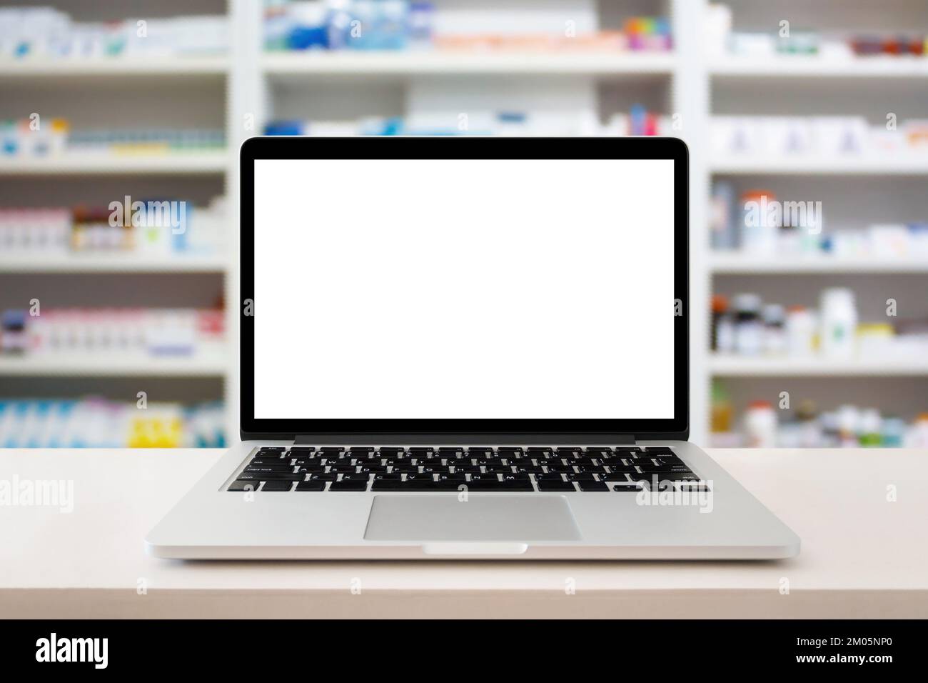 pharmacy store with laptop computer on medical counter Stock Photo - Alamy