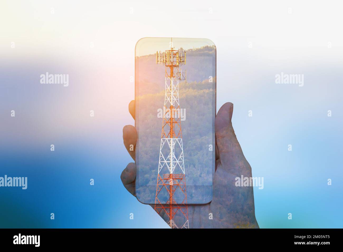 hand hold mobile smartphone double exposure with telecom tower ...