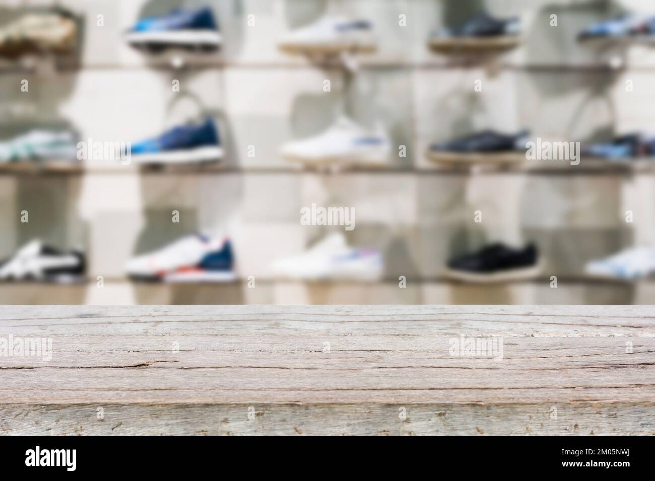 Wood table top with Shoes on shelves in the shoes store blur background ...