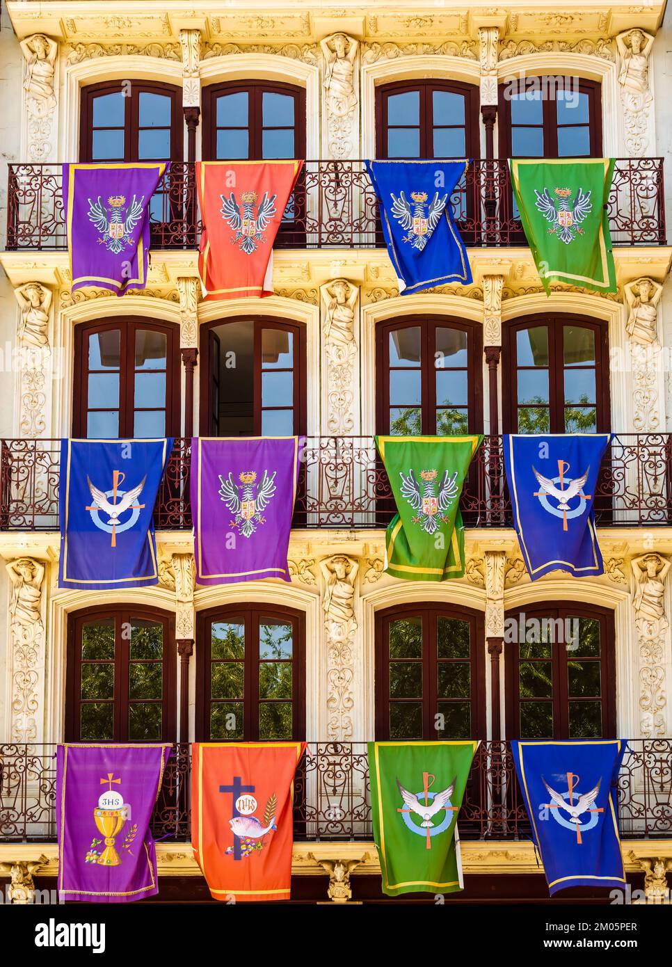 Historical banners on buildings during Corpus Christi in Toledo, Spain ...