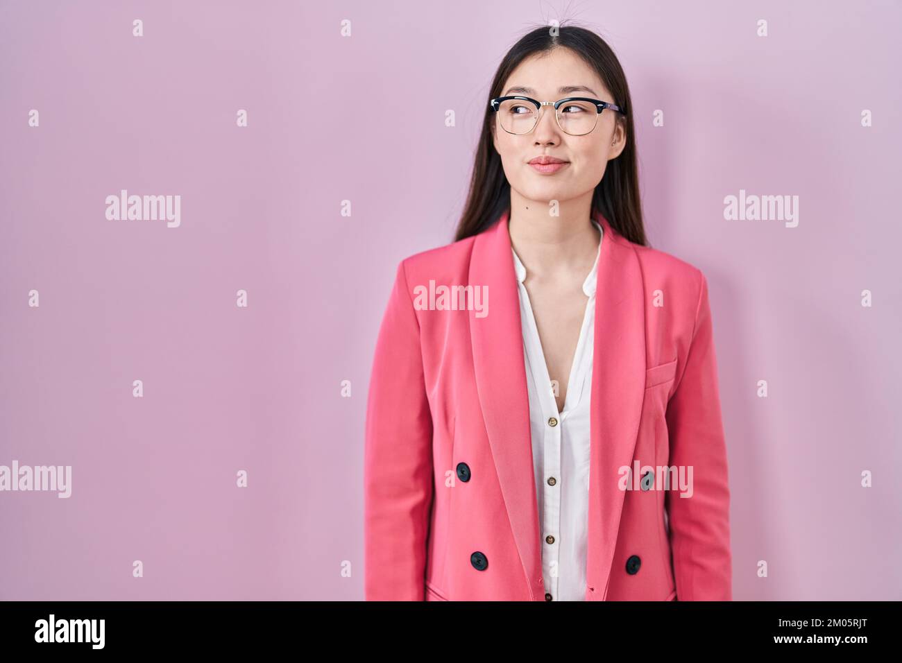 Chinese business young woman wearing glasses smiling looking to the ...