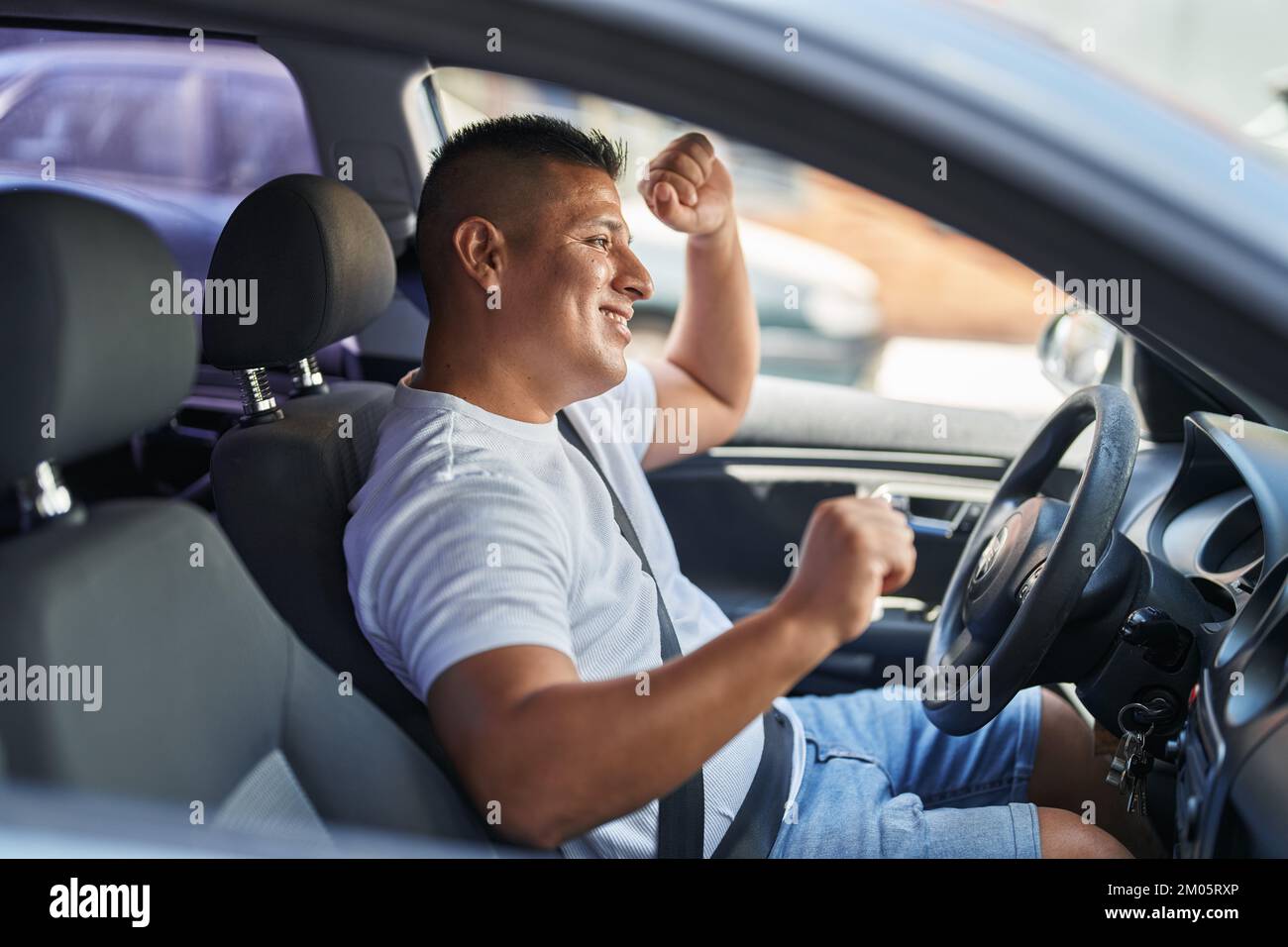 Man driving car dancing listening hi-res stock photography and images ...