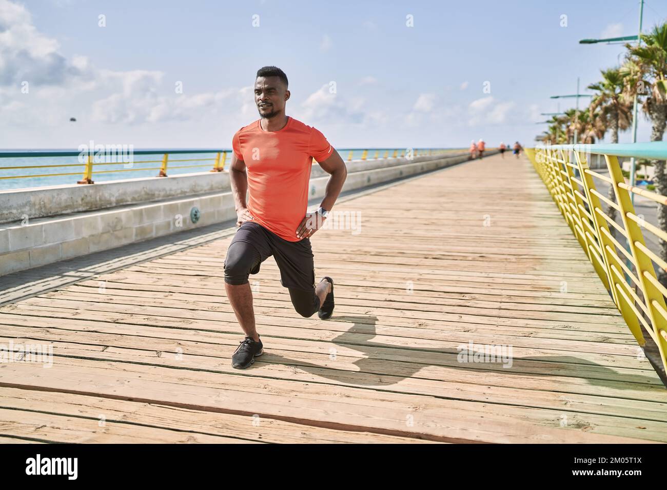 Young african american man wearing sportswear training at seaside Stock ...