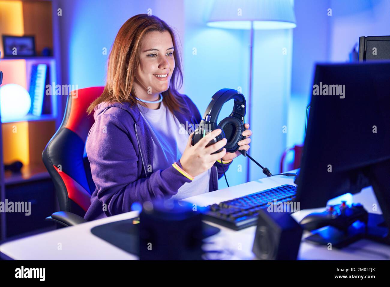 Young beautiful plus size woman streamer smiling confident holding ...