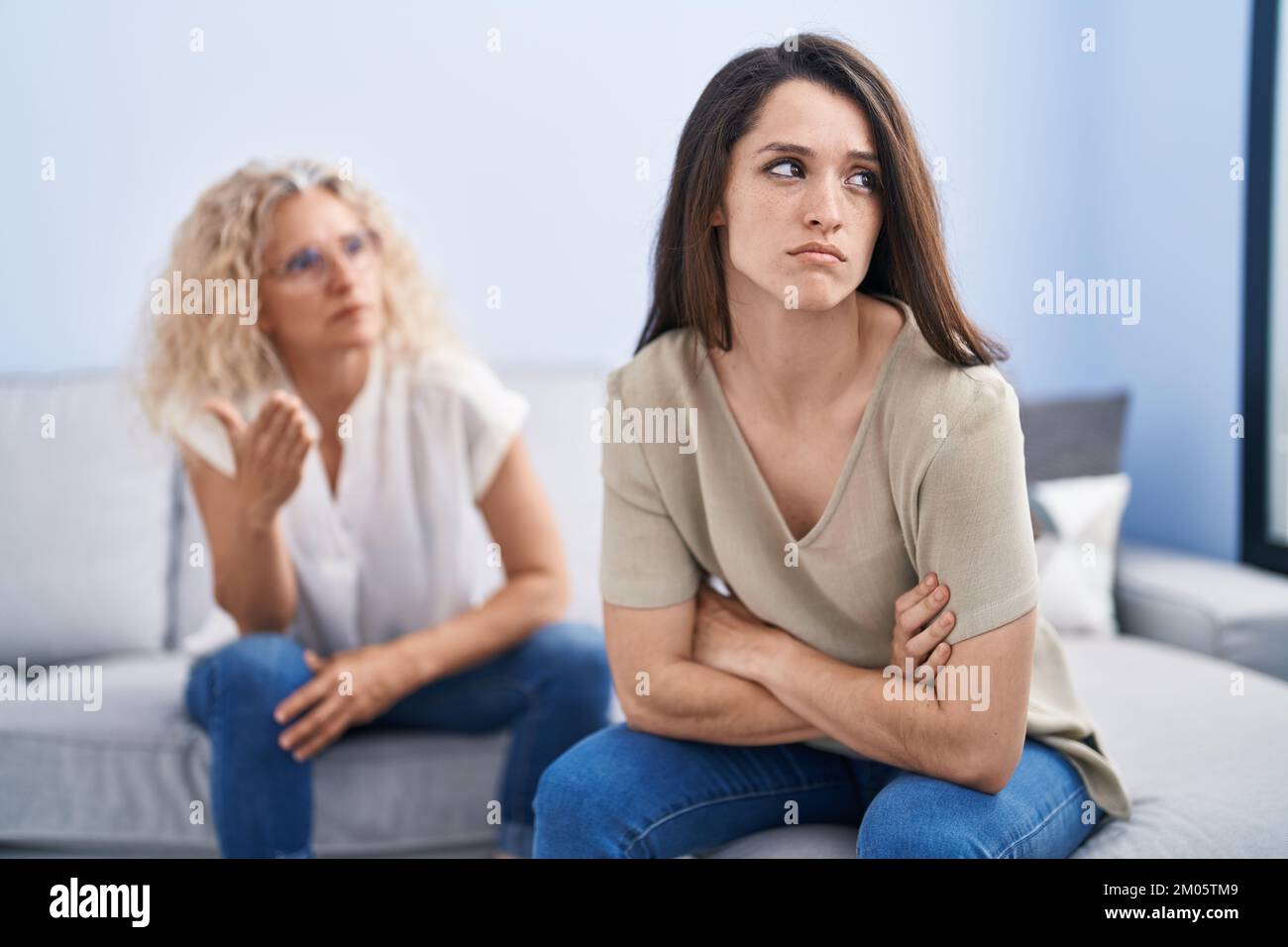 Two women mother and daughter arguing at home Stock Photo - Alamy