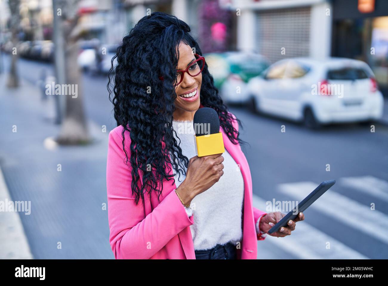 African American Woman Reporter Working Using Microphone Holding