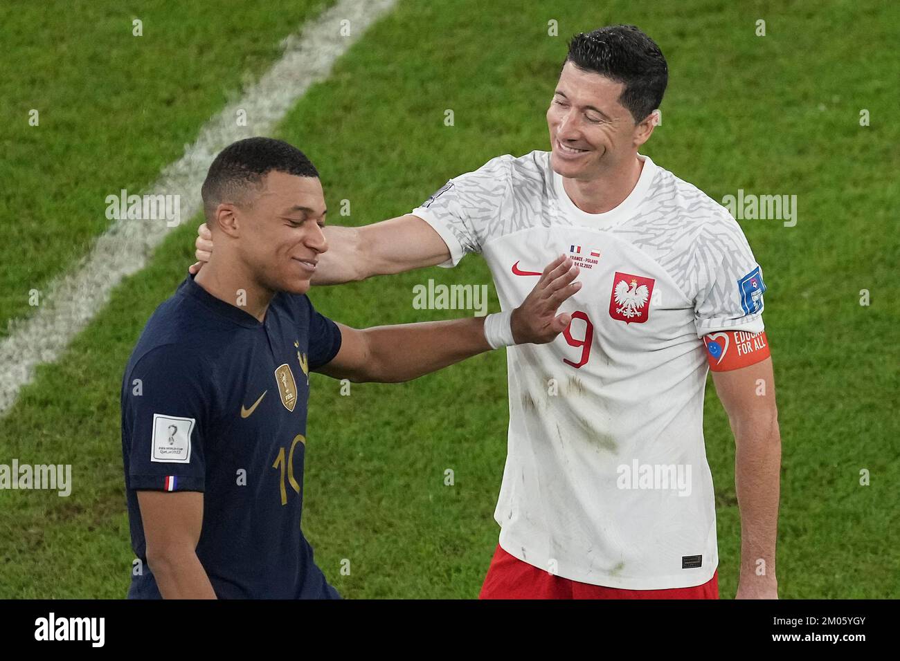 Doha, Qatar. 4th Dec, 2022. Robert Lewandowski (R) of Poland reacts ...