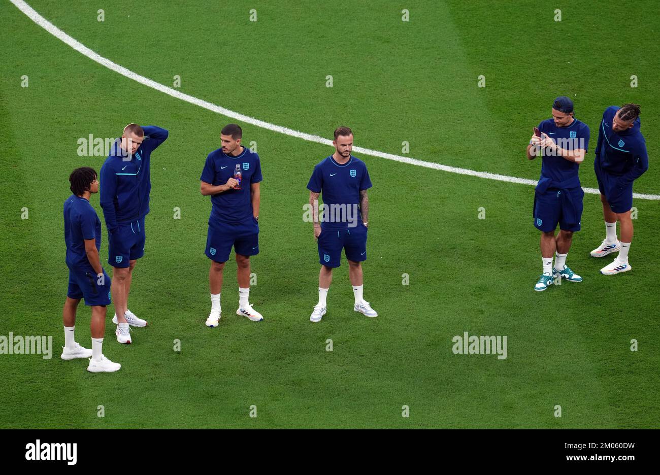 England's Jack Grealish alongside Kalvin Phillips, takes a picture as ...