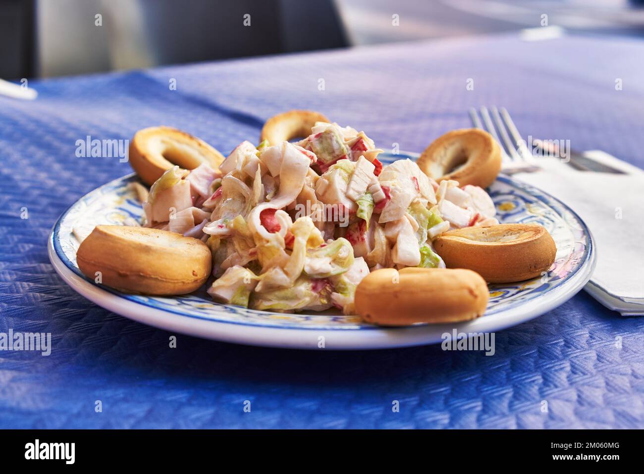 Plate of spanish salad on paper surface Stock Photo - Alamy