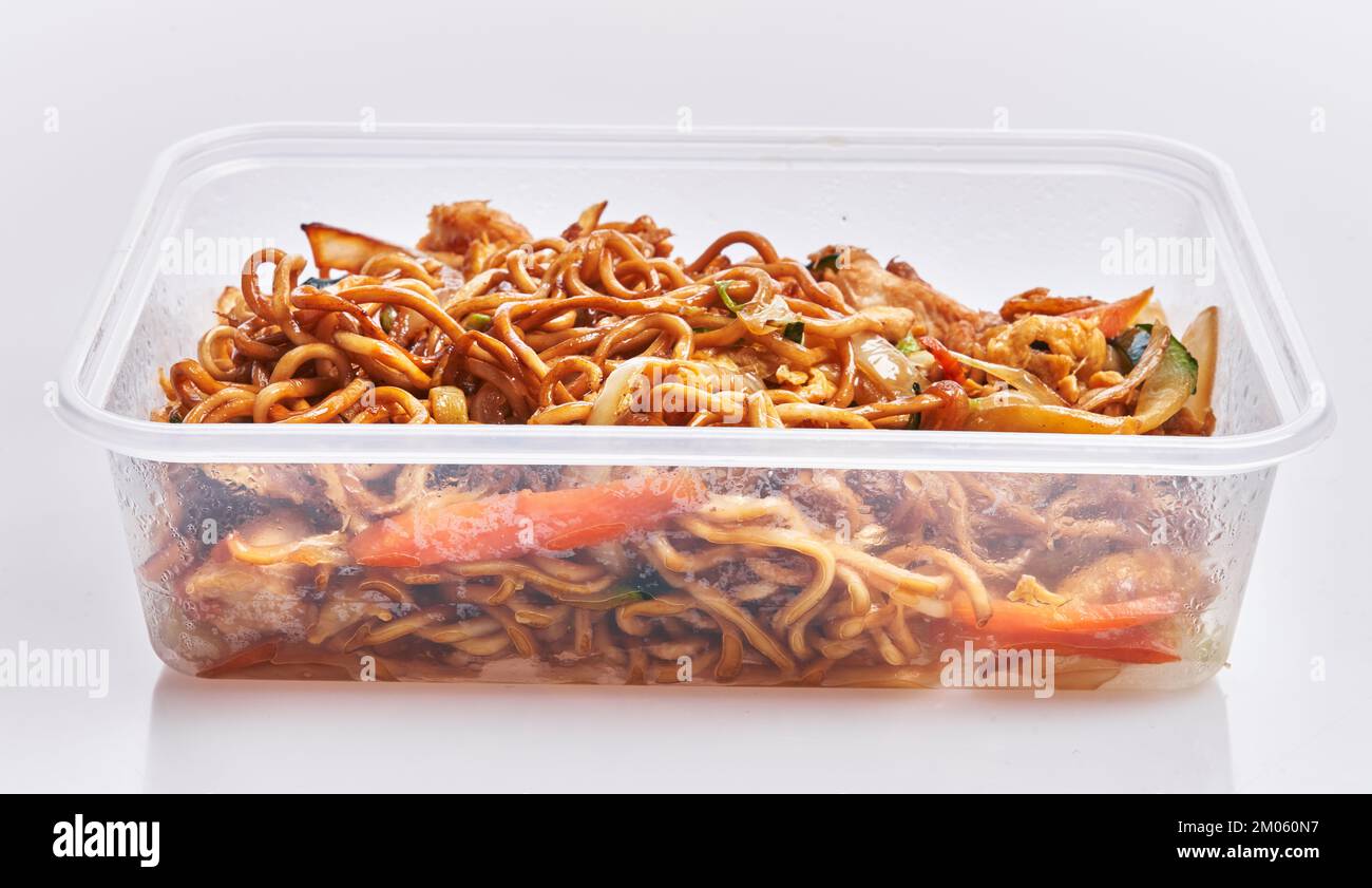 Delicious thai noodles with chicken and vegetable on delivery plastic ...