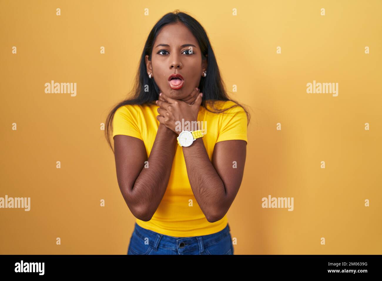 Woman choking indian hi-res stock photography and images - Alamy