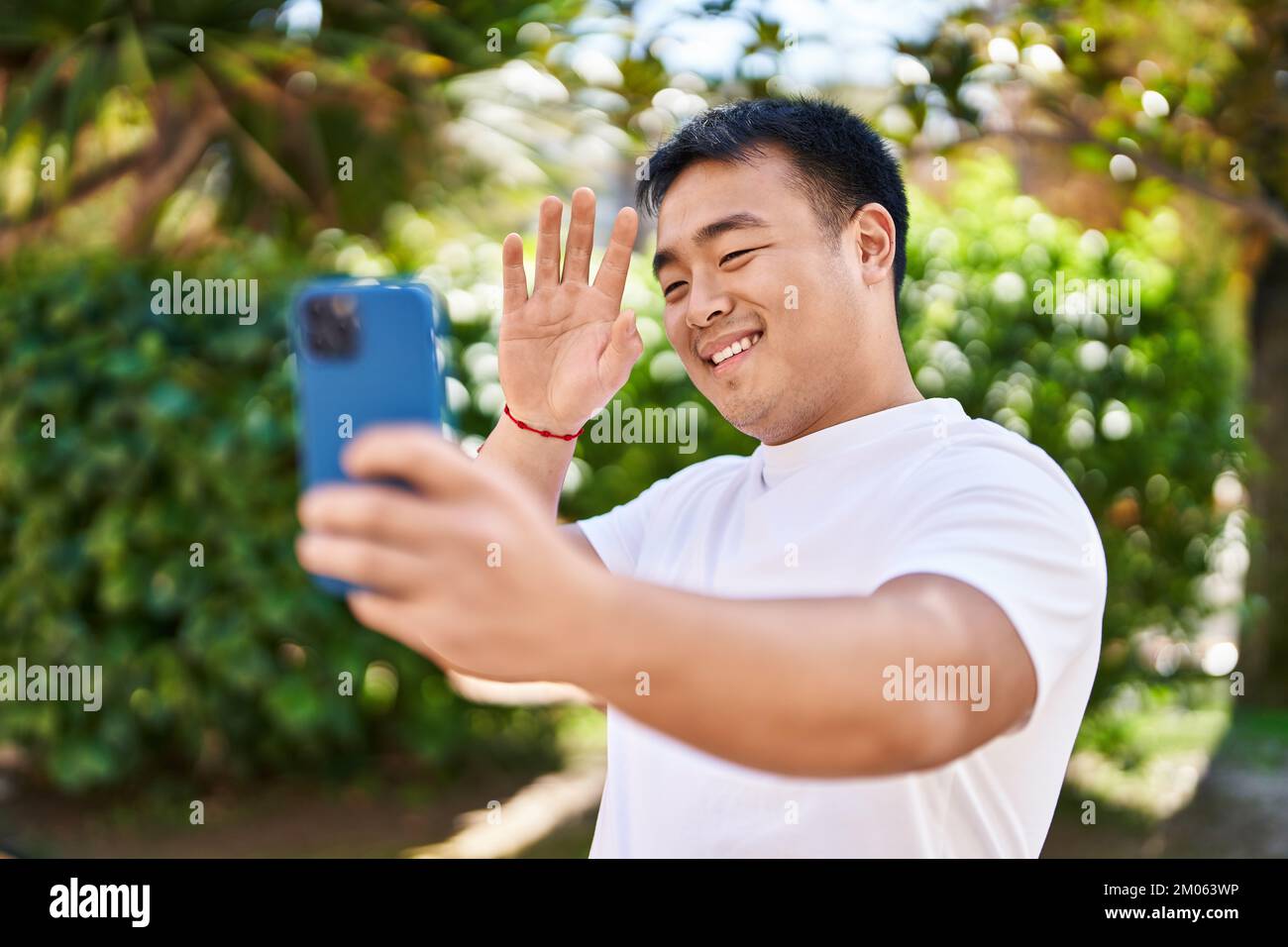 Young chinese man smiling confident having video call at park Stock ...