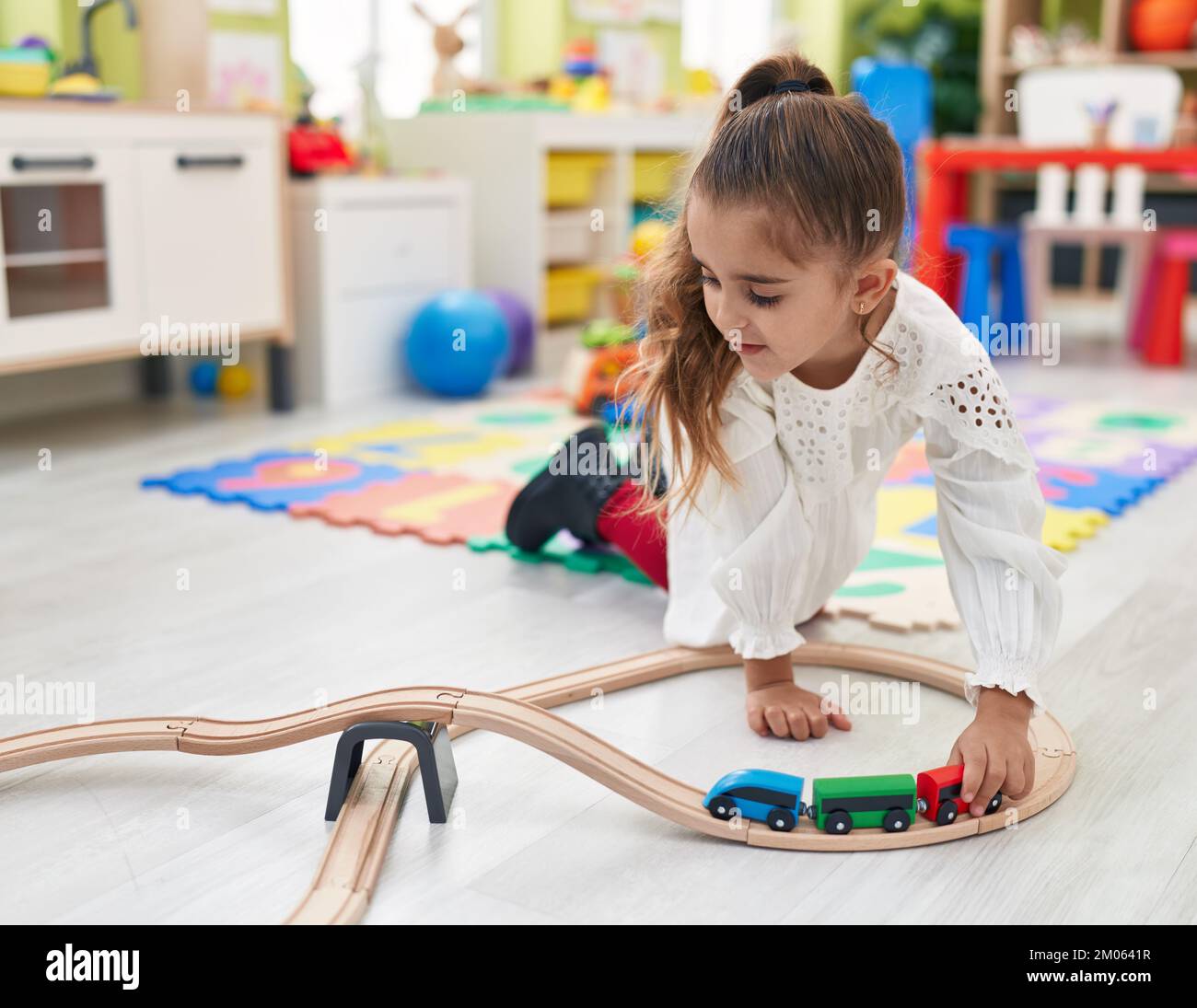 Preschool girl playing toy car hi-res stock photography and images - Alamy