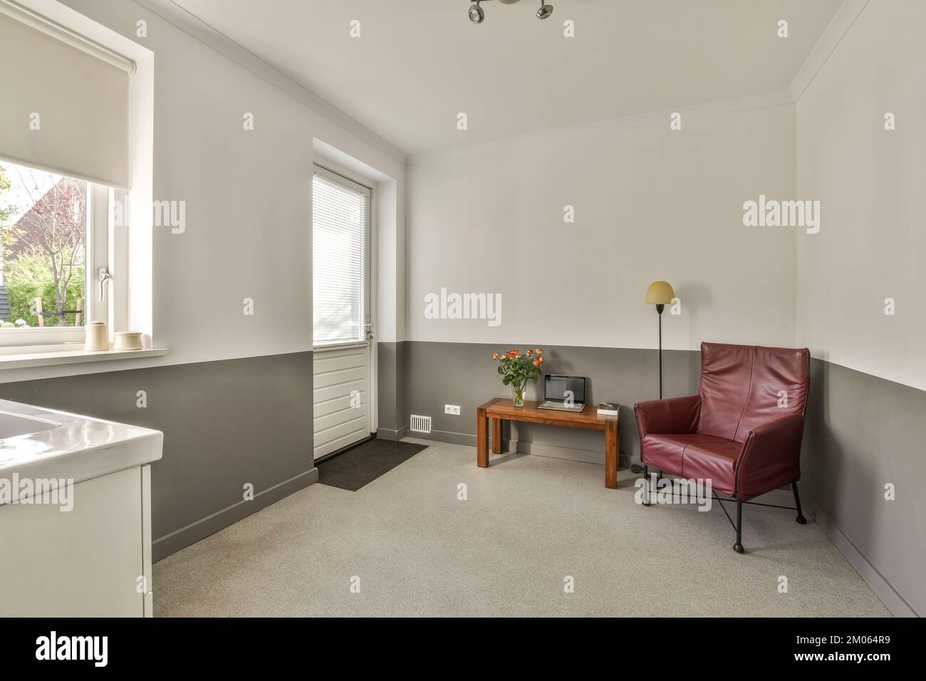 Spacious study room with table , armchair and cupboard with balcony ...