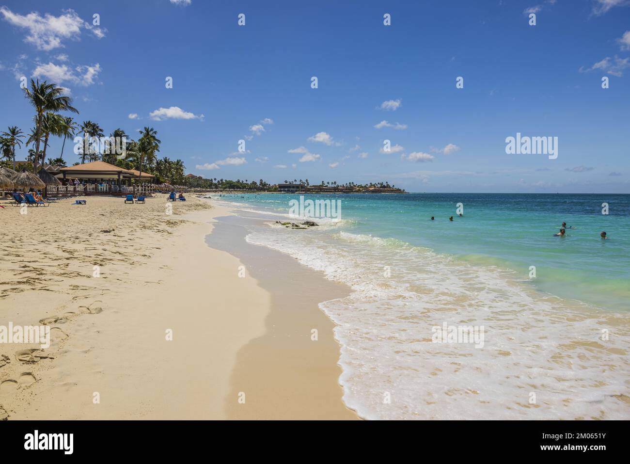 View of Eagle beach in Atlantic ocean with white sands on sunny day ...