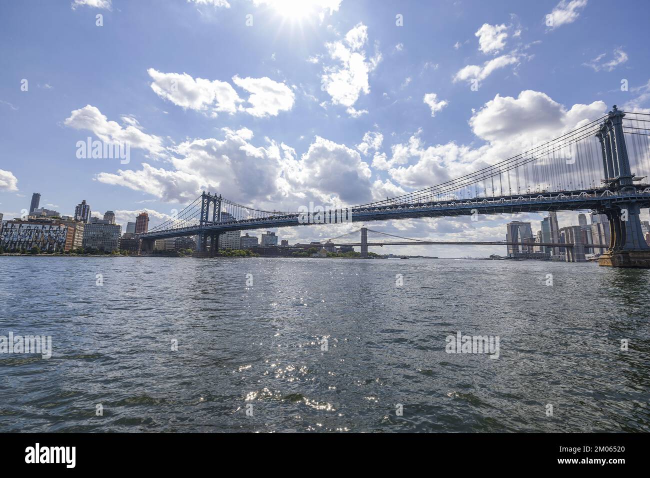 Beautiful panoramic view of Brooklyn bridge over Hudson river and skyscrapers of Manhattan. USA ...