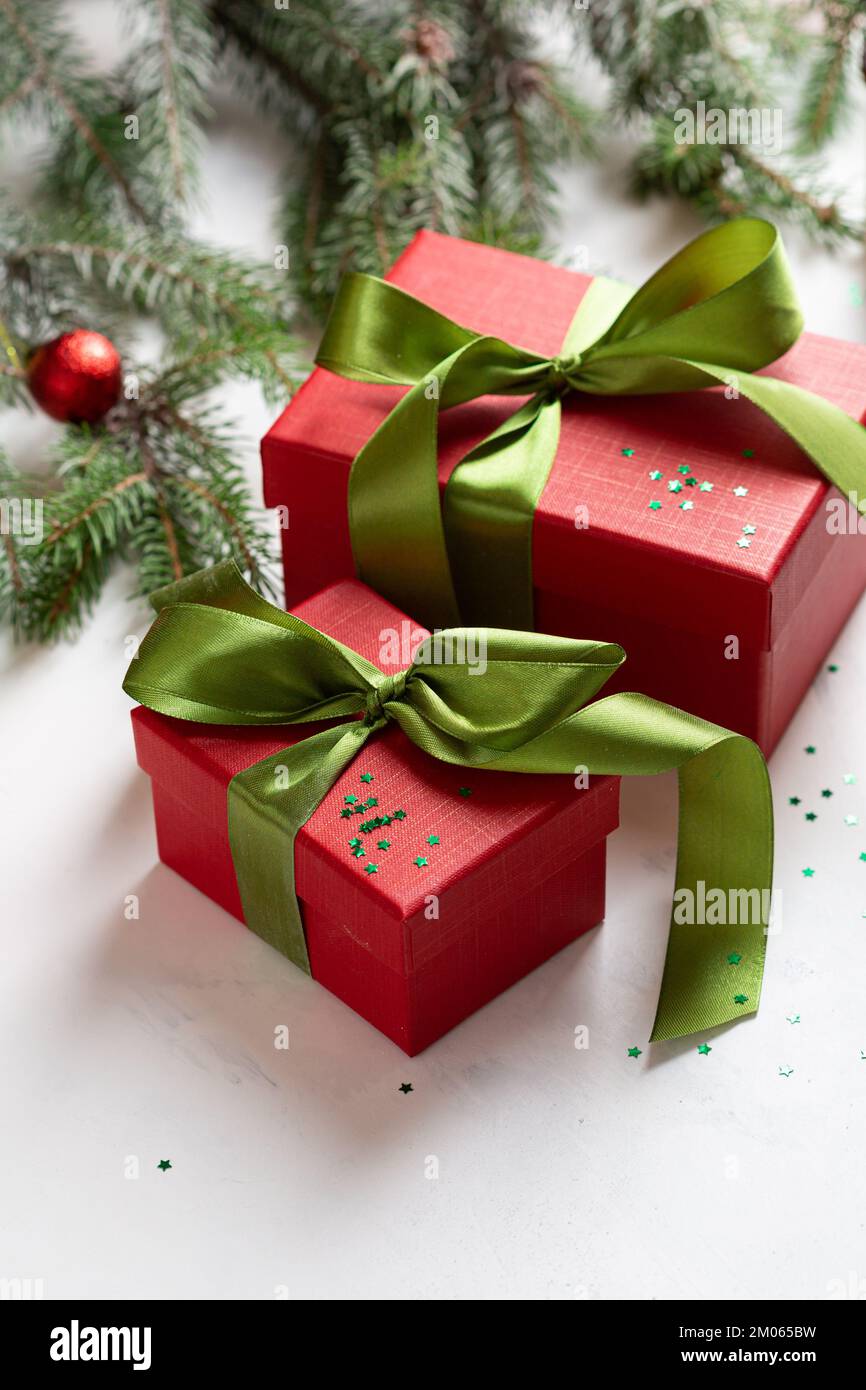 Close up of Red Christmas present box with green bow holiday concept ...