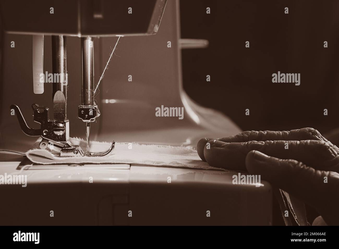 sewing machine and old grandmother's hand Stock Photo - Alamy
