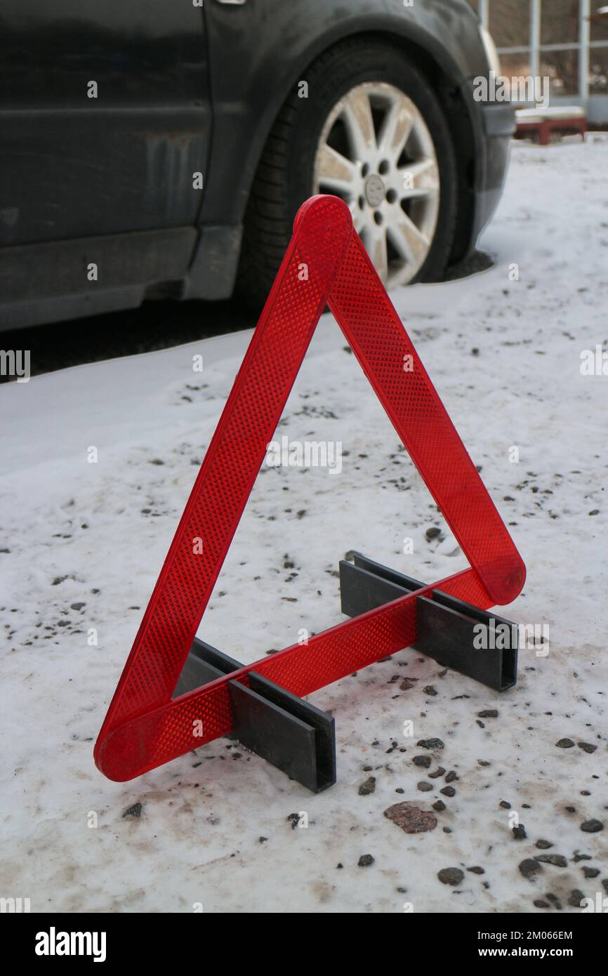 red warning triangle on winter snowy road, danger concept Stock Photo ...