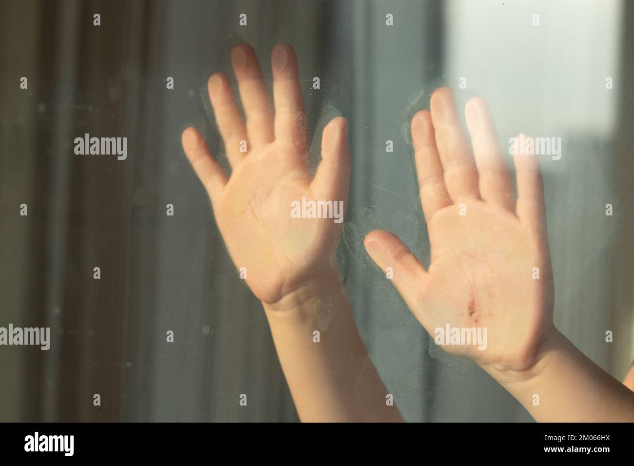 Children's hand with a notch on the glass during quarantine Stock Photo ...