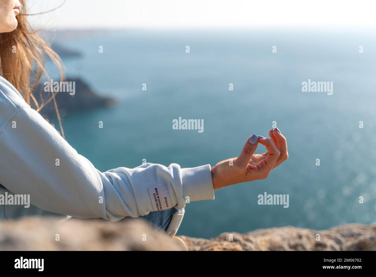 yoga, gesture and healthy lifestyle concept - hand of meditating yogi ...