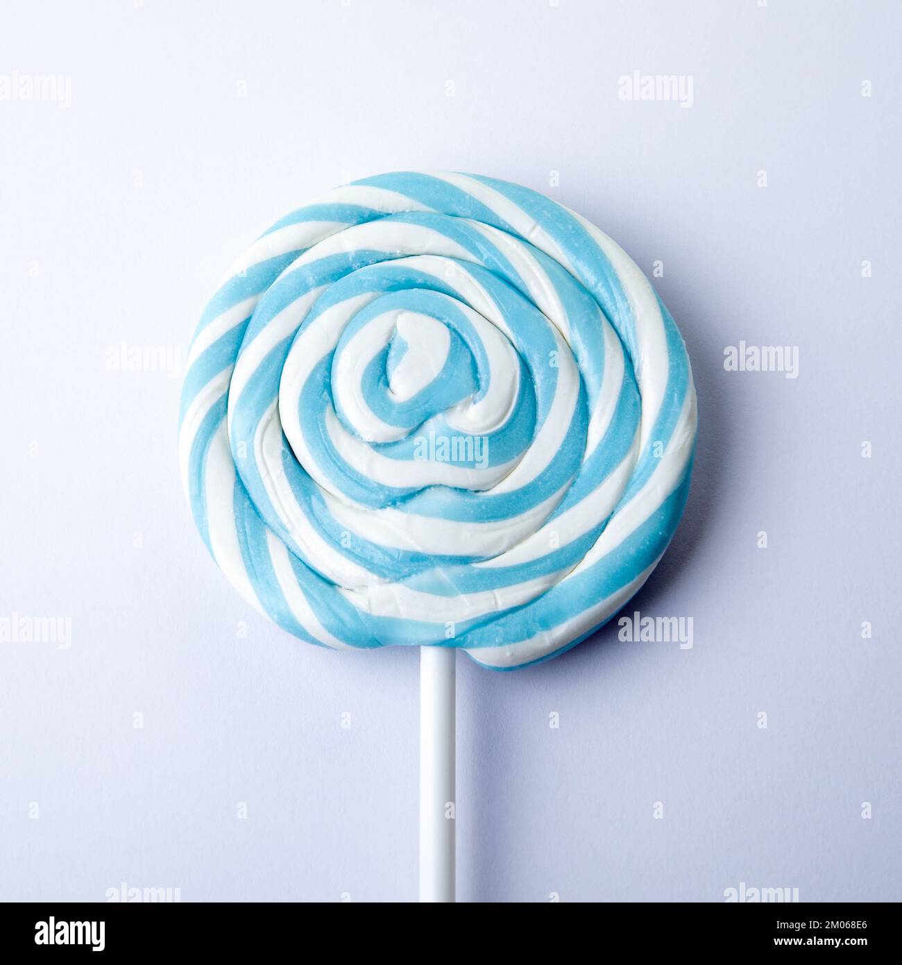 Blue striped candy on a stick, white background. Lollipop Stock Photo ...