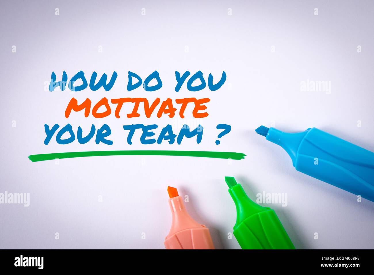 How Do You Motivate Your Team. Text and colored markers on a white ...