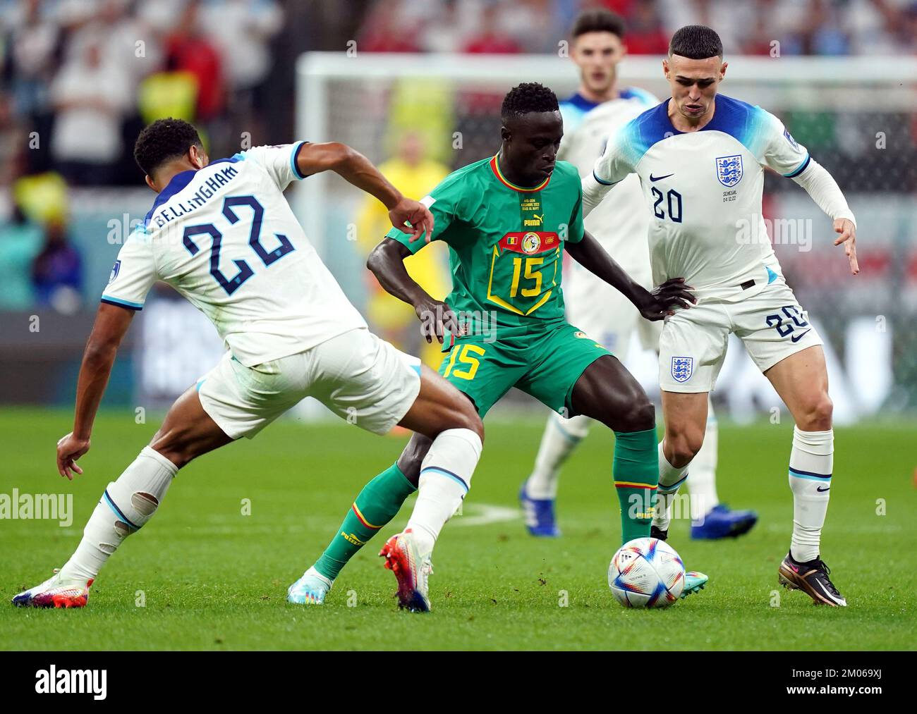 England's Jude Bellingham and Phil Foden (right) combine to tackle ...
