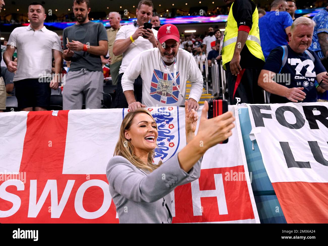 Laura Woods, ITV presenter takes a photograph with England fans in the ...