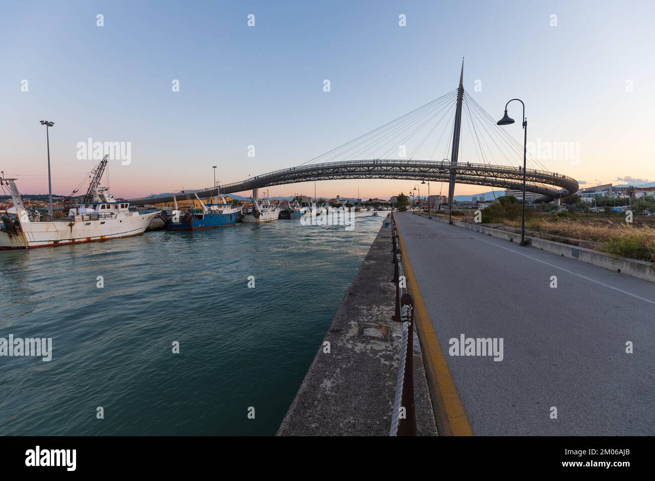 The famous 'Ponte del mare' (sea bridge) in Pescara, Italy, at sunset ...