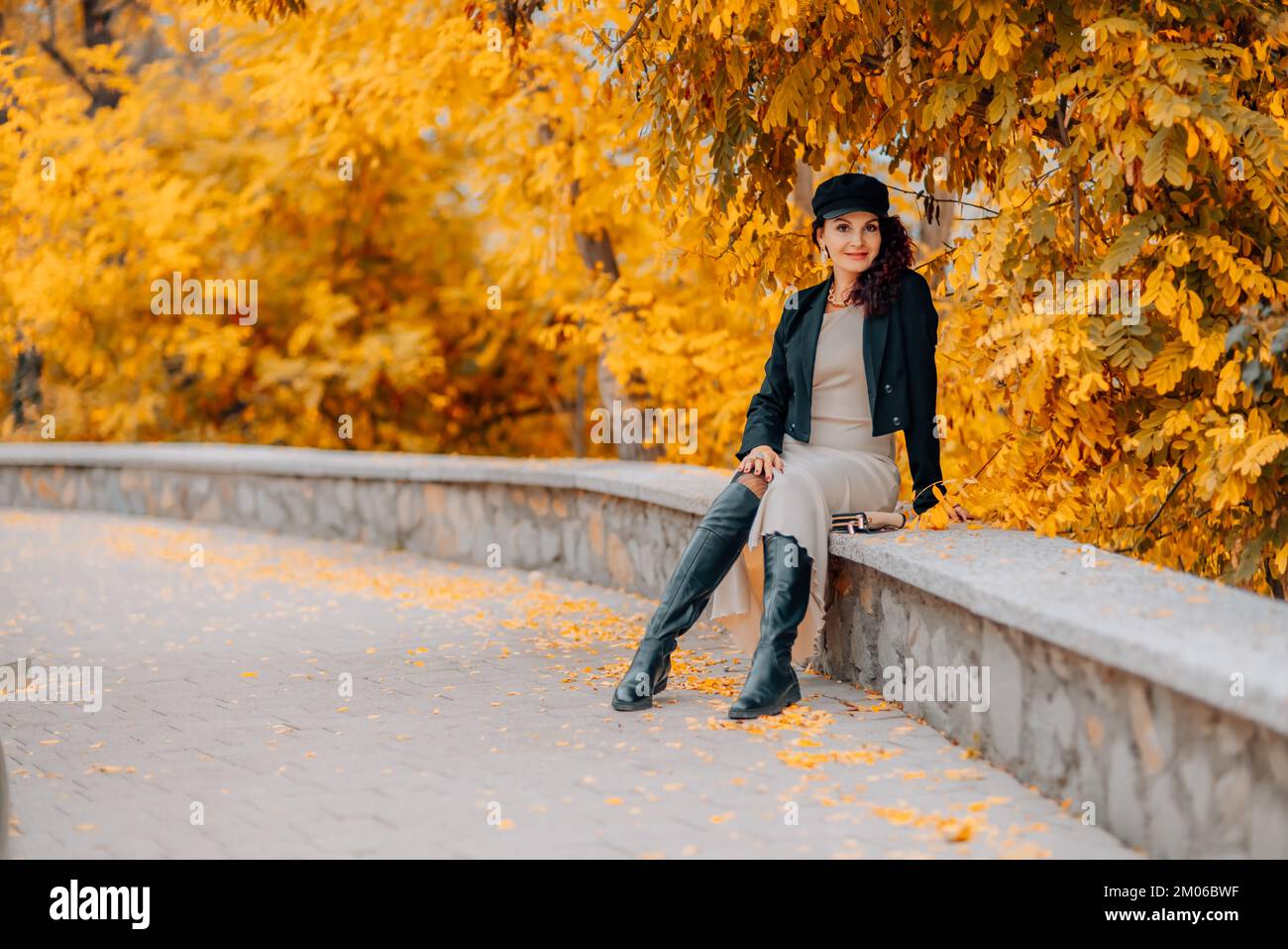 A woman walks outdoors in autumn, enjoys the autumn weather Stock Photo ...