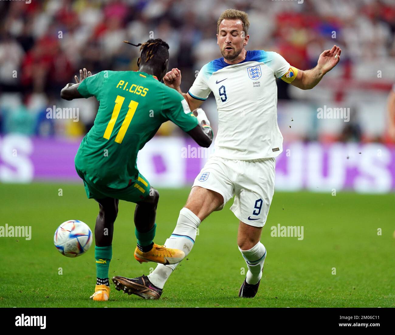 England's Harry Kane and Senegal's Pathe Ciss (left) during the FIFA ...
