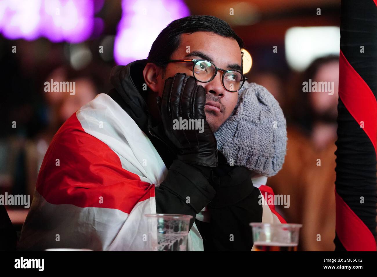 An England fan looks dejected at the Vinegar Yard in London, watch a ...