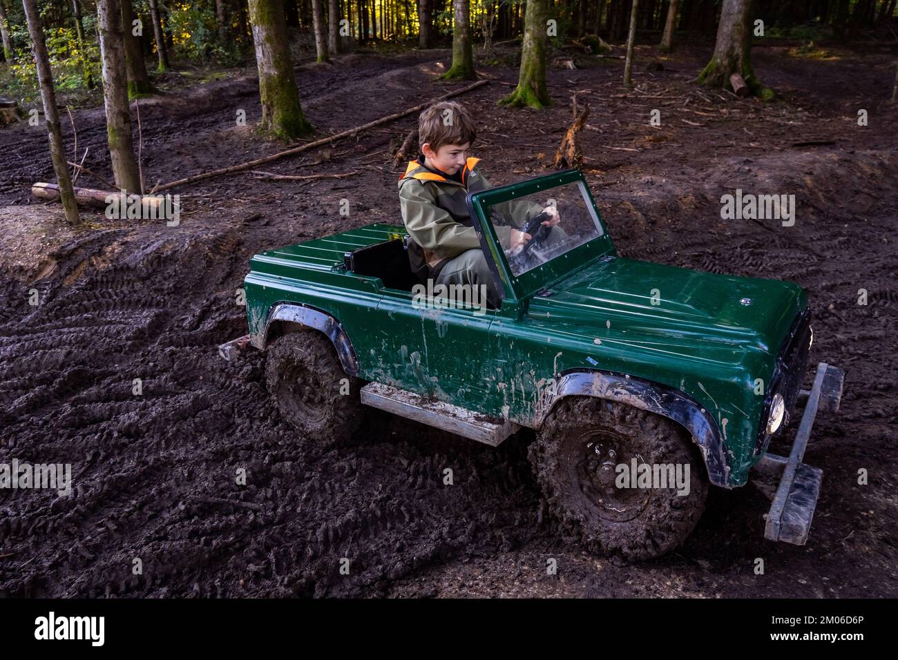 A Teen ride in an open iron children's car. Extreme form of ...