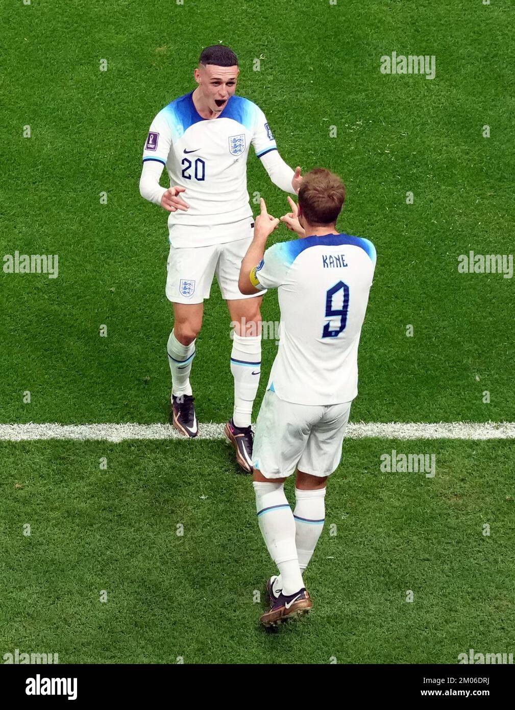 England's Harry Kane celebrates scoring the second goal with Phil Foden ...