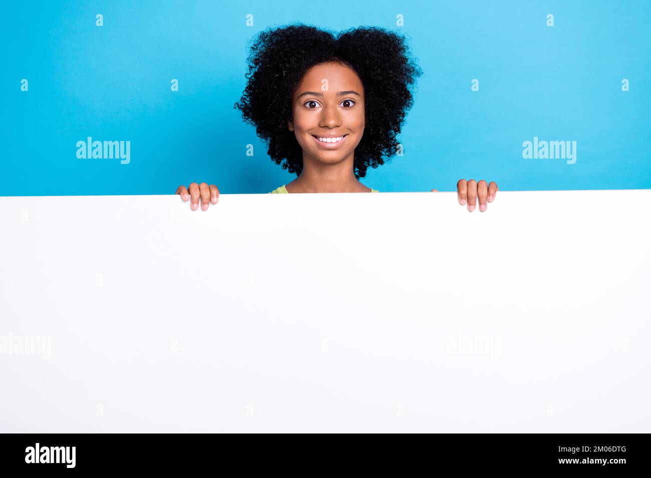 Photo of funky chevelure black curly hair teenager youngster girl hold ...