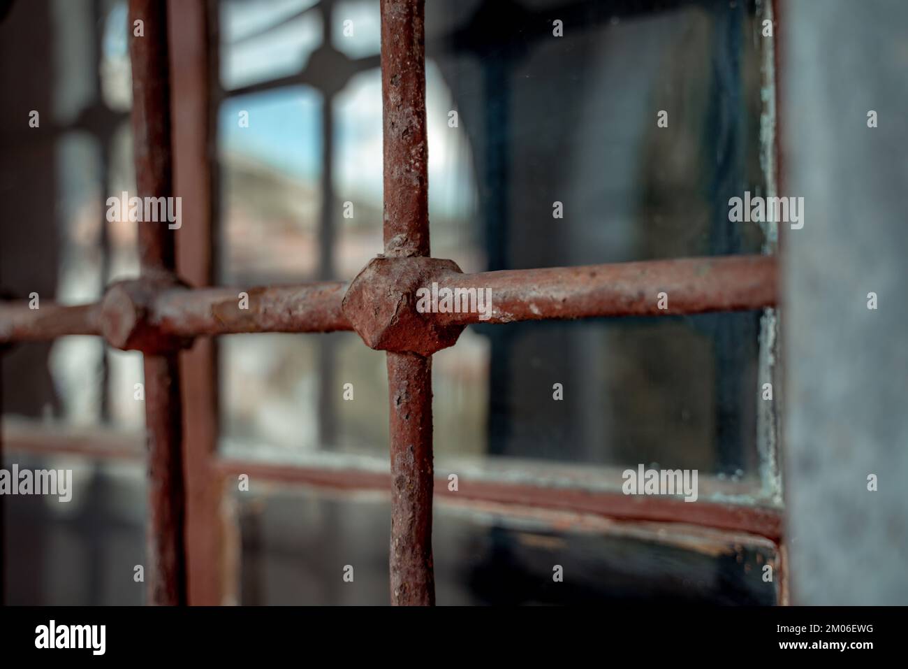 Antique iron grating on the window. A piece of wall is visible Stock ...