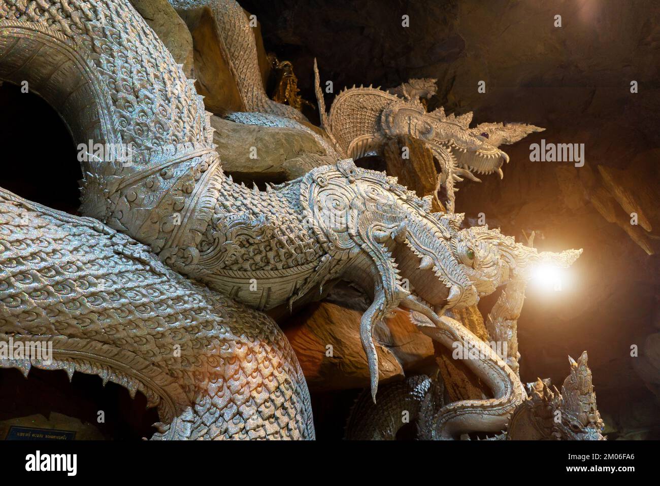 A cave full of mythical animal art called Naga Stock Photo - Alamy
