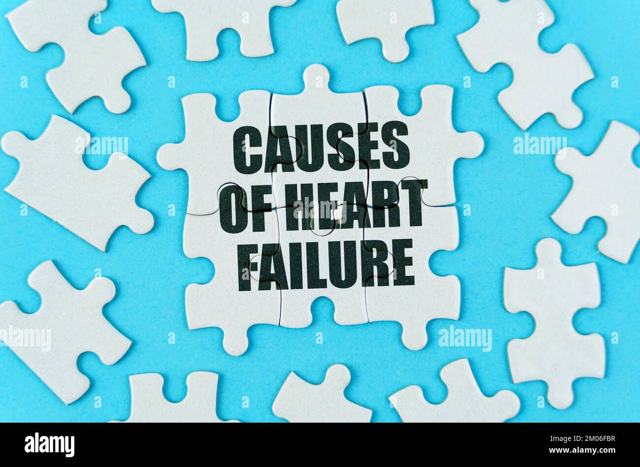 Medical concept. On a blue background are white puzzles with the ...